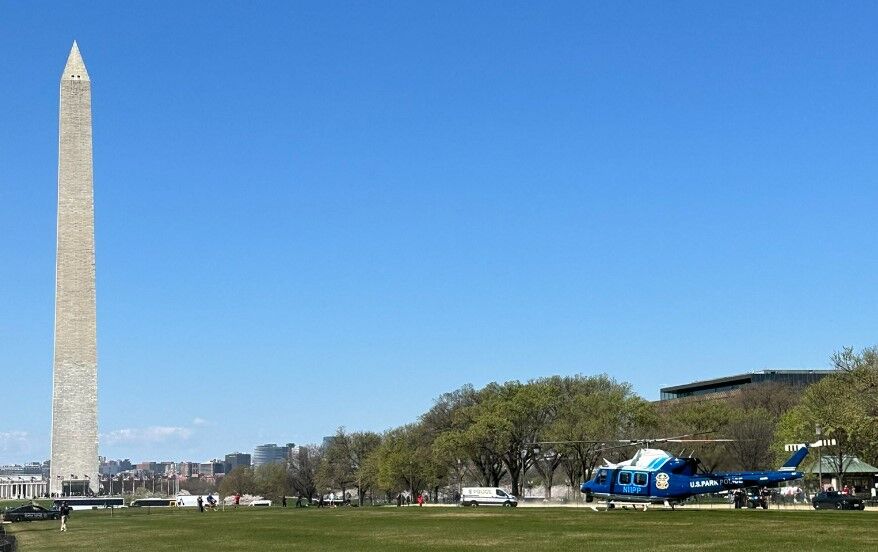 Helicopter lands on National Mall to transport officer injured by ...