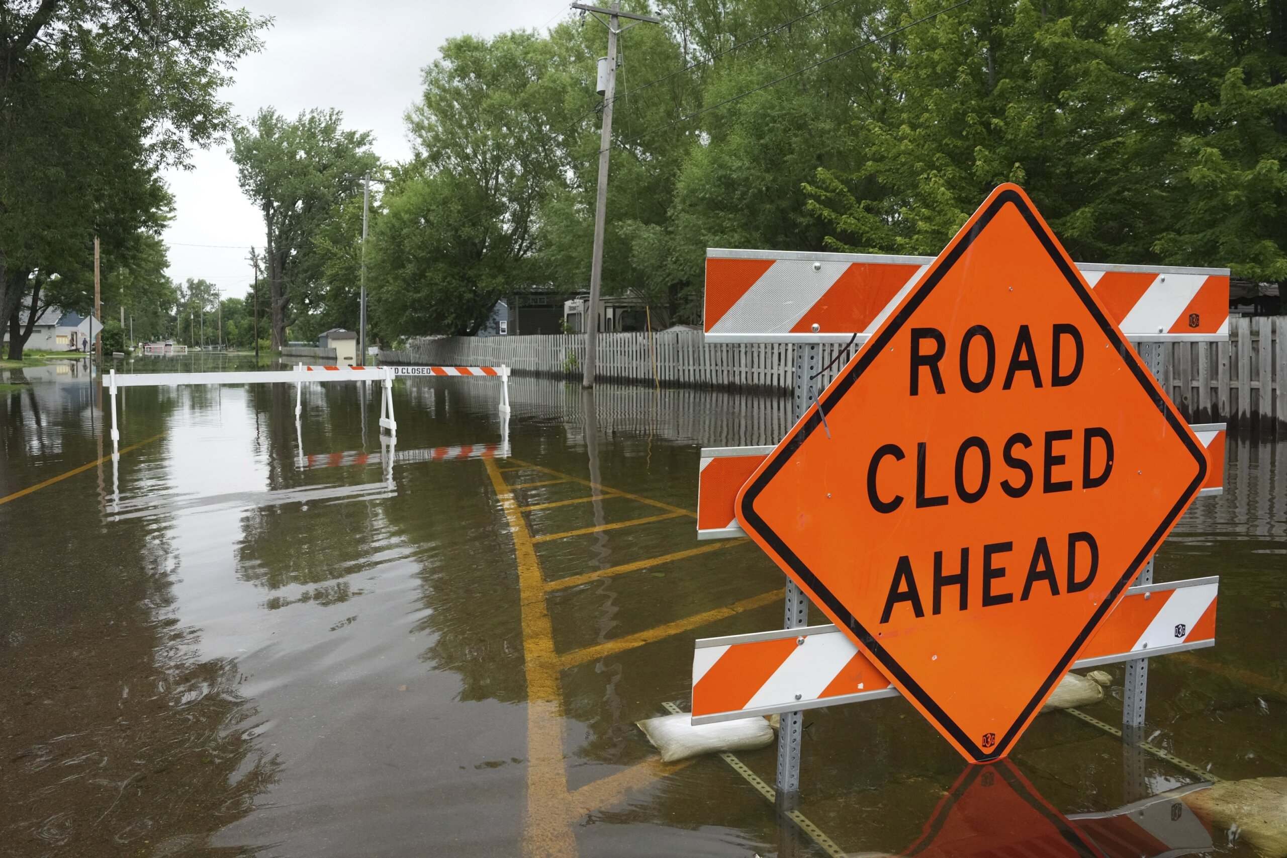 Floodwaters inundate Minnesota towns while another storm transformed ...