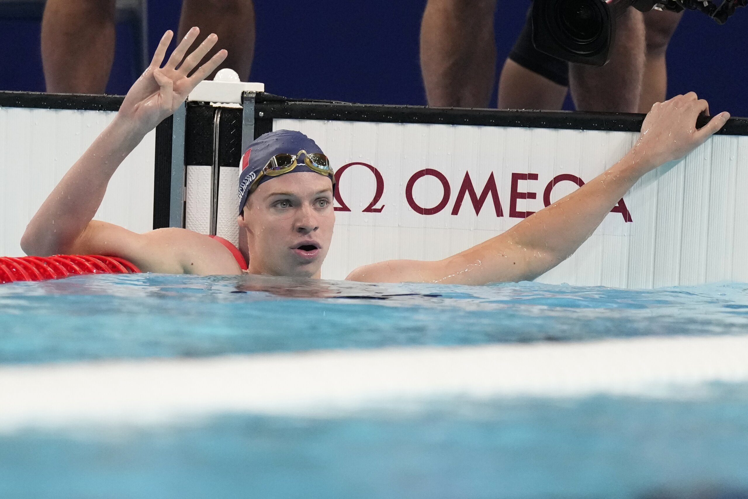 Léon Marchand captures 4th Olympic swimming gold, setting off a party ...
