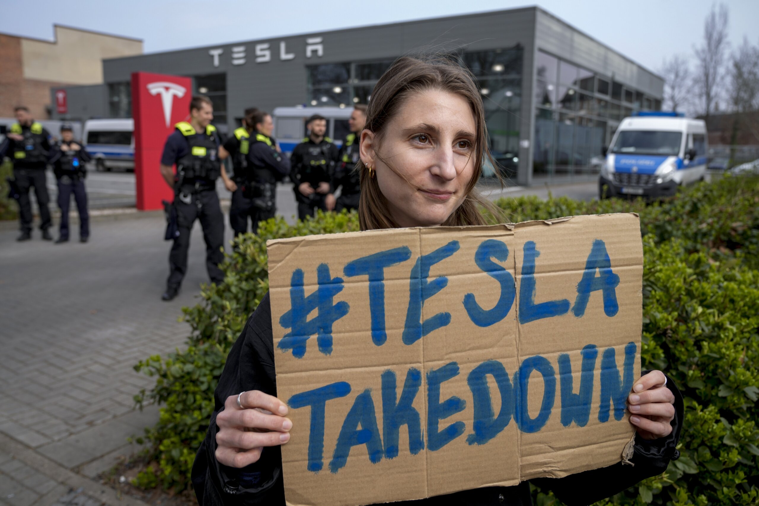 Protests continue at Tesla showrooms amid talk Elon Musk could soon ...