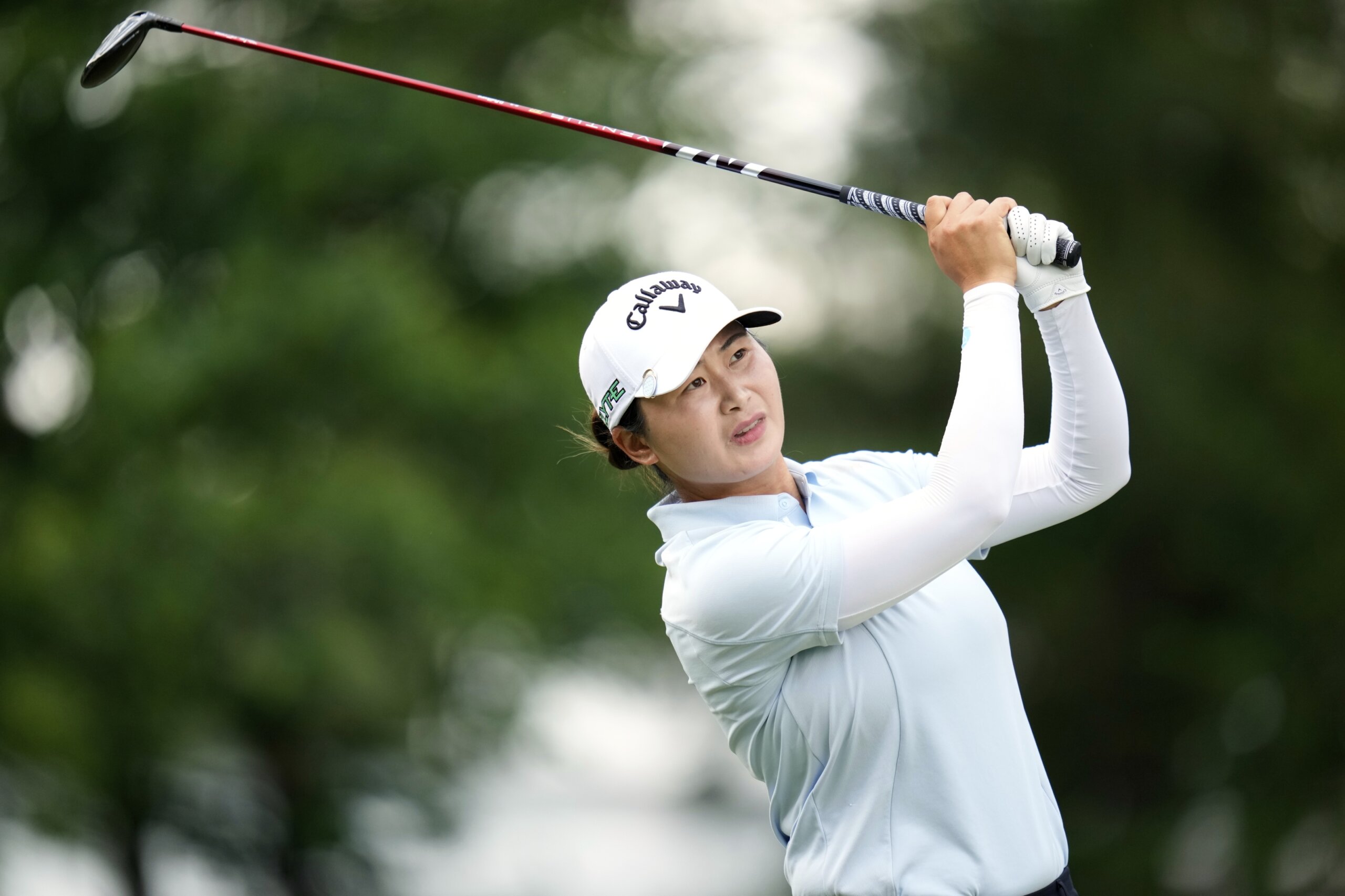 Yan Liu has an albatross and a late birdie to hang onto the lead in the ...