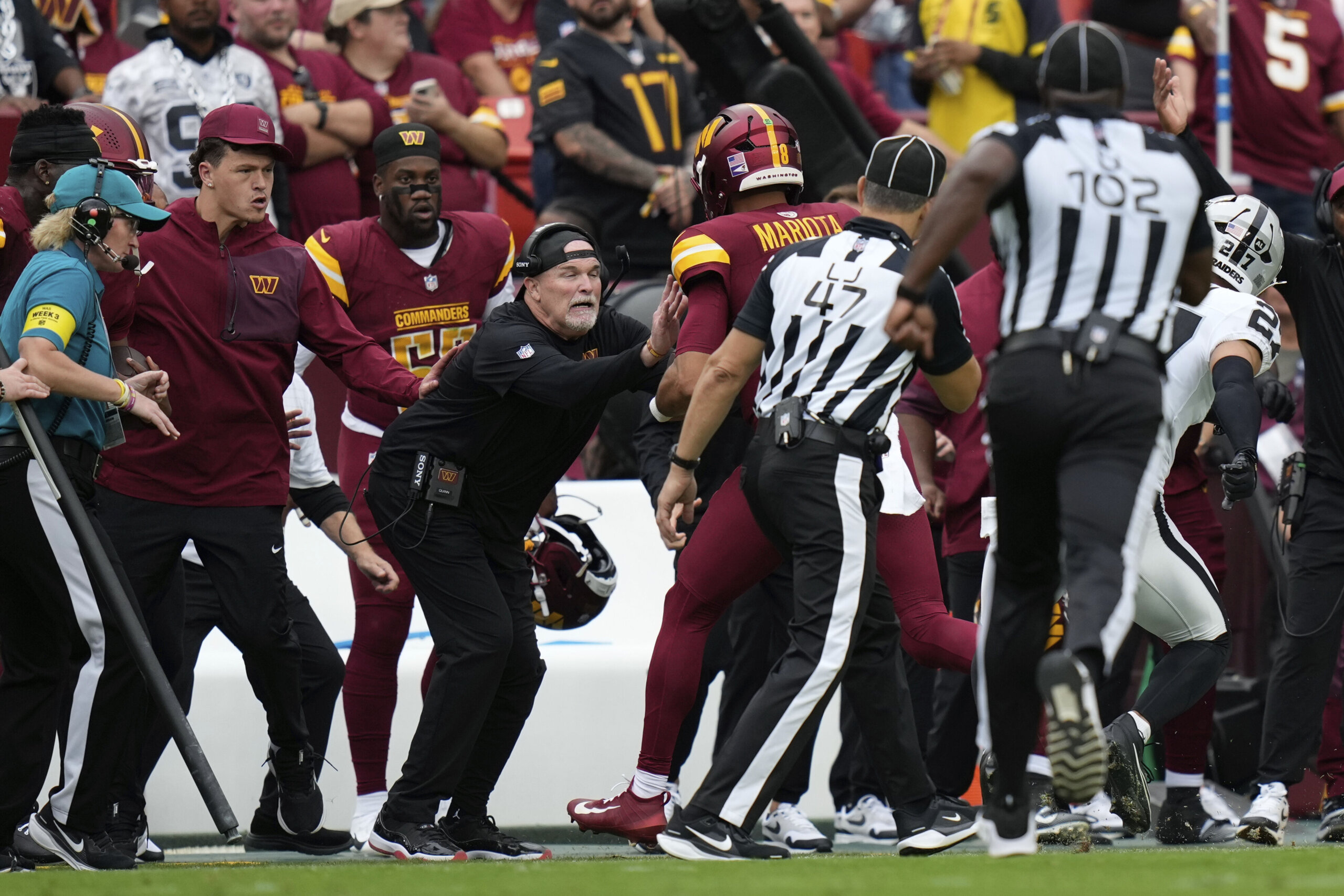 Commanders coach Dan Quinn bloodied in sideline collision with Marcus ...