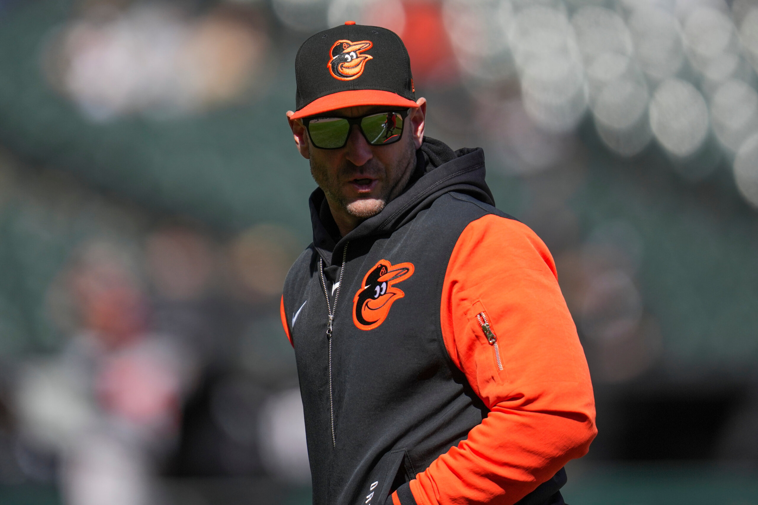 Orioles manager Craig Albernaz is OK after taking a line drive off his ...